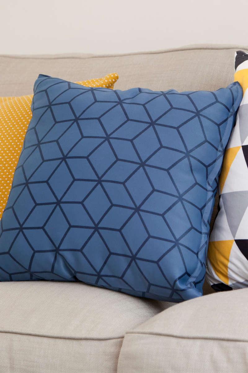 How can you make cushions look good on a colourful sofa? - Woods Furniture